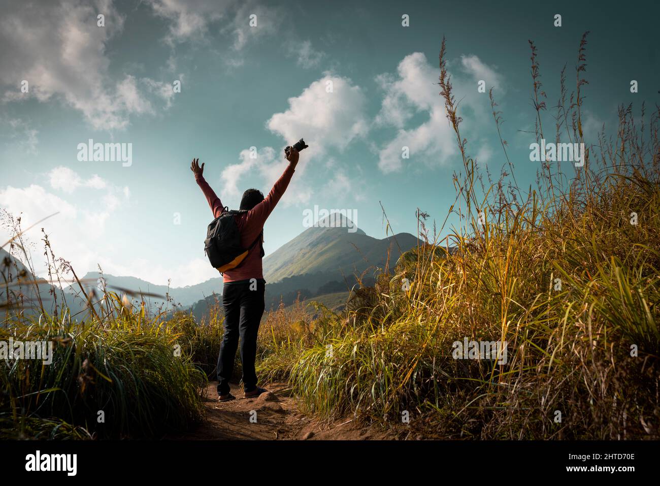 Landscape photographer enjoying view at mountains, amazing nature view ...