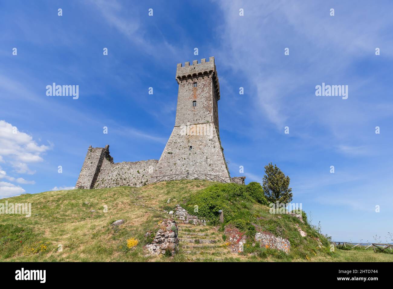 Brick tower Rocca of Radocofani on top the basalt hill with sky ...