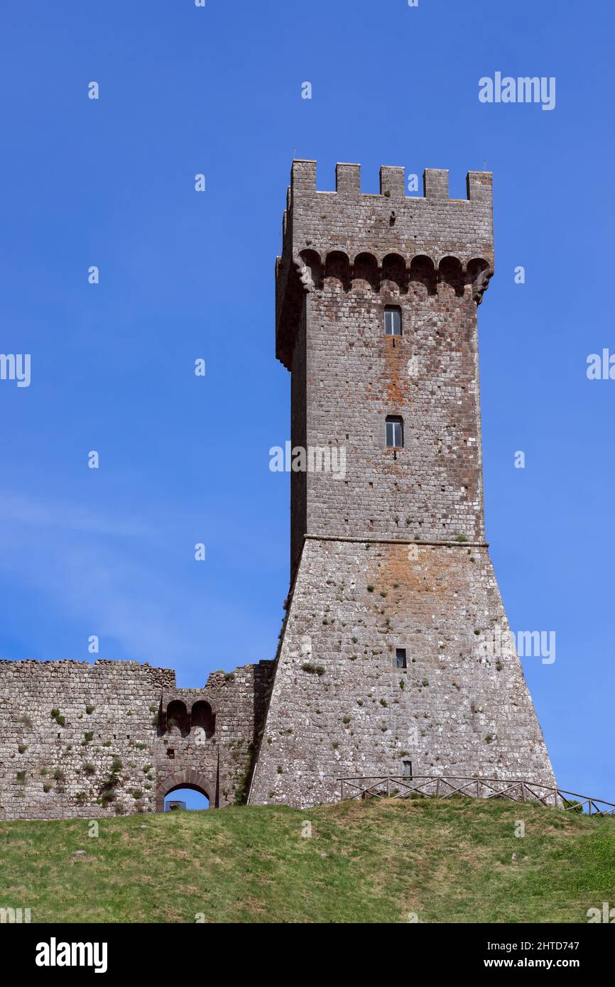 The top of Rocca tower of Radicofani castle decorated with battlements ...