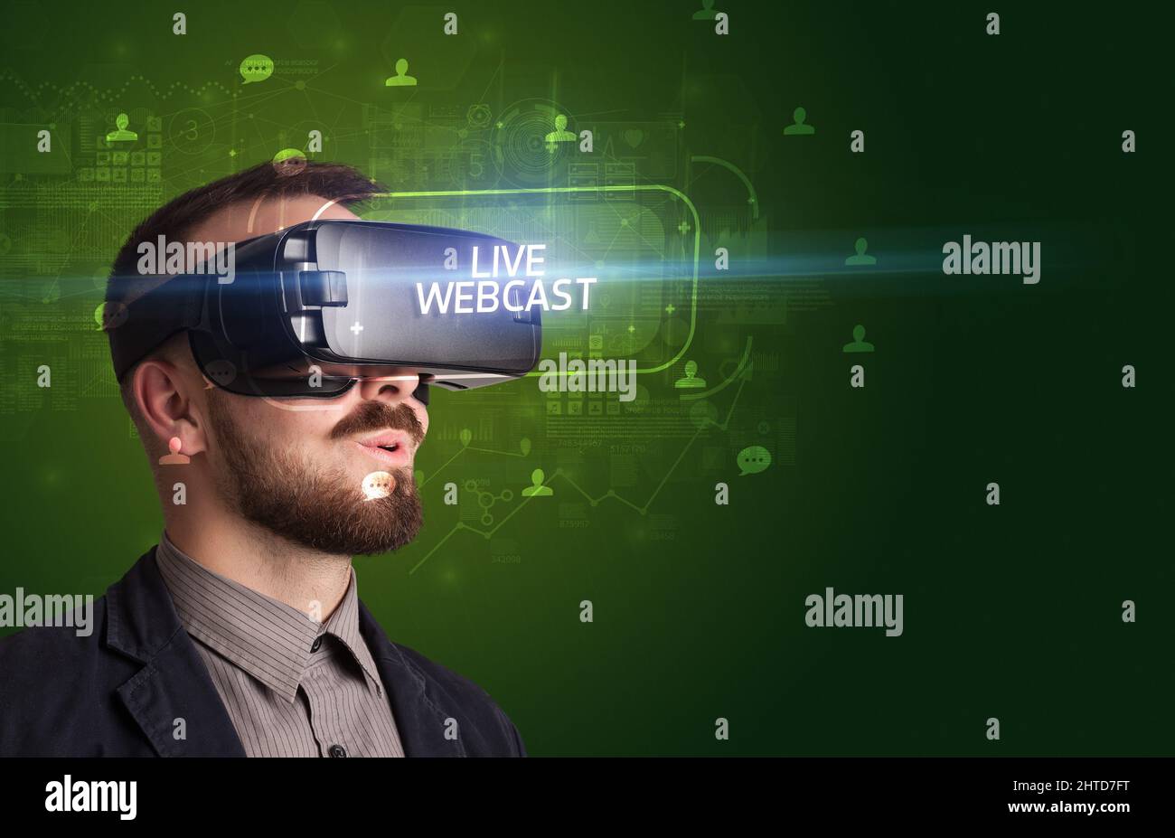 Businessman looking through Virtual Reality glasses, social media ...