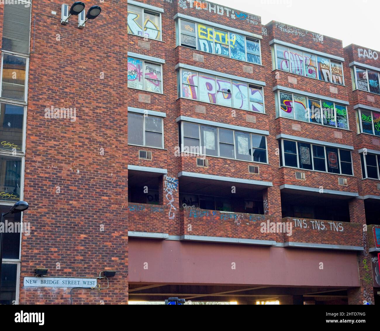 Graffiti adorns the walls and windows of a disused building on New ...