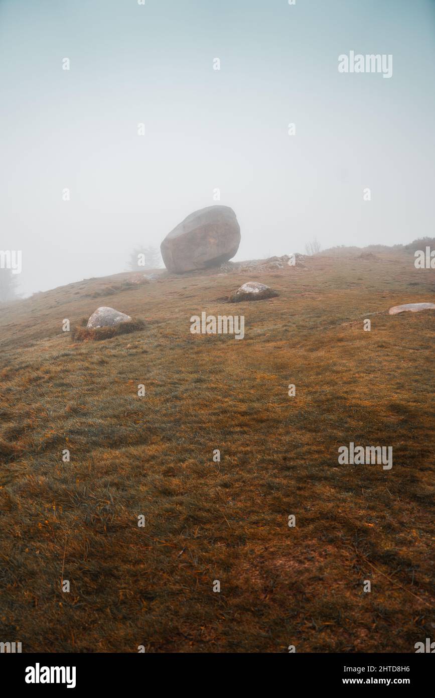 Beautiful portrait of rocks on a foggy hill in Ireland Stock Photo - Alamy