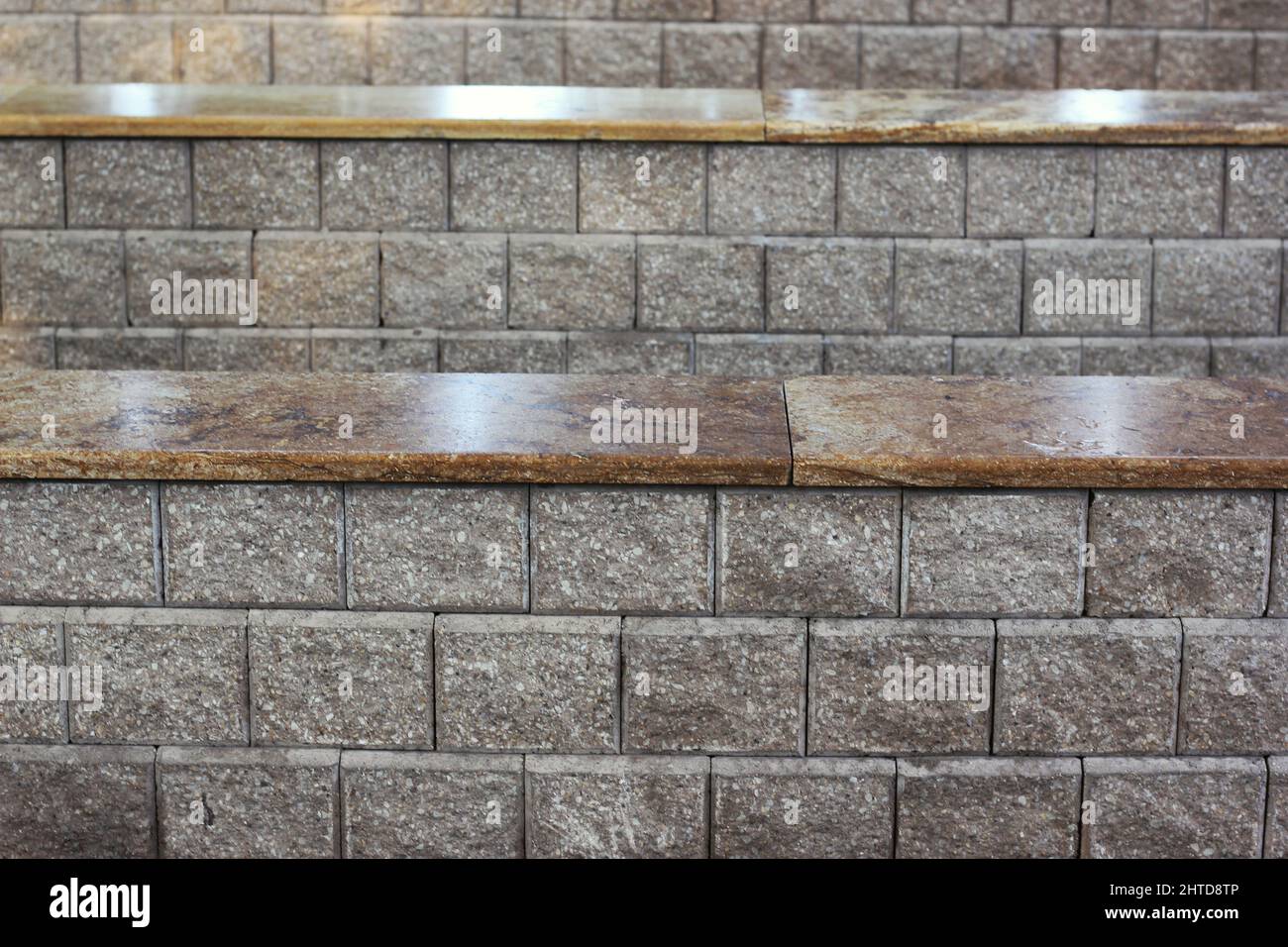 Rows of benches and seating constructed out of masonry and stone blocks ...