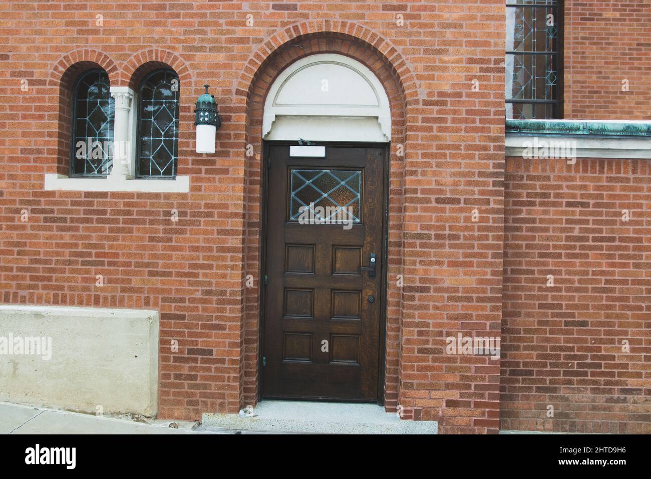 Beautiful shot of a brick building door Stock Photo - Alamy