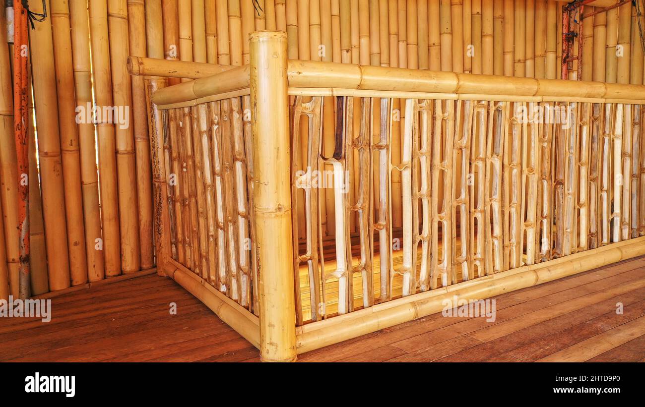 Golden Yellow ornamental Bamboo Railing. Curved staircase with an Asian ...