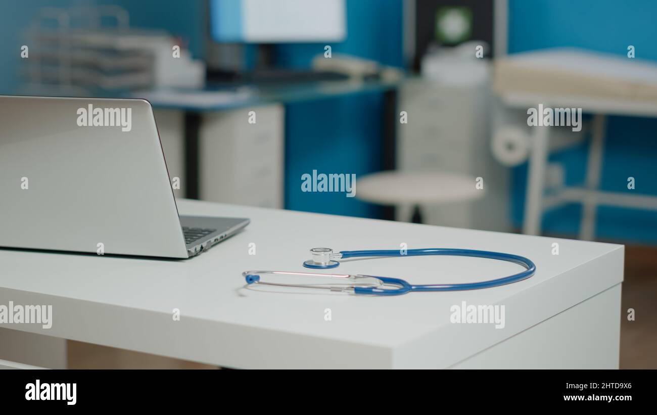 Close up of professional stethoscope placed on white desk in empty ...