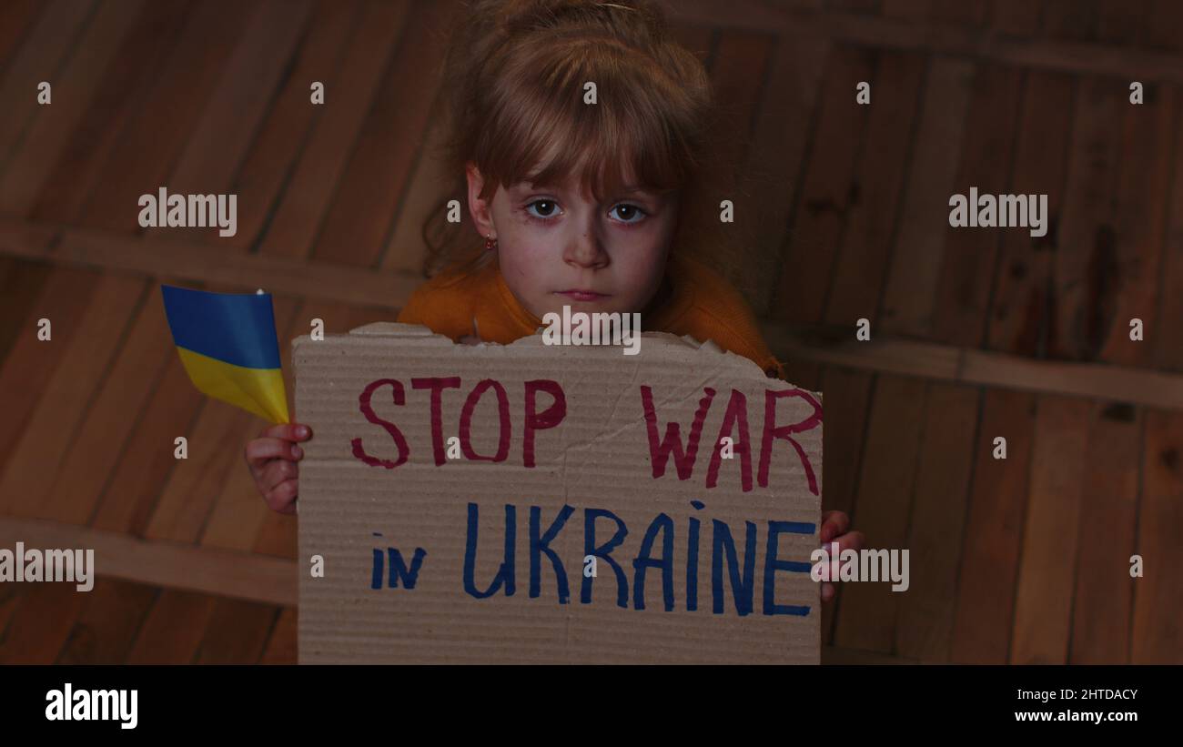 KYIV, UKRAINE - Feb 24, 2022: Homeless girl kid showing cardboard ...