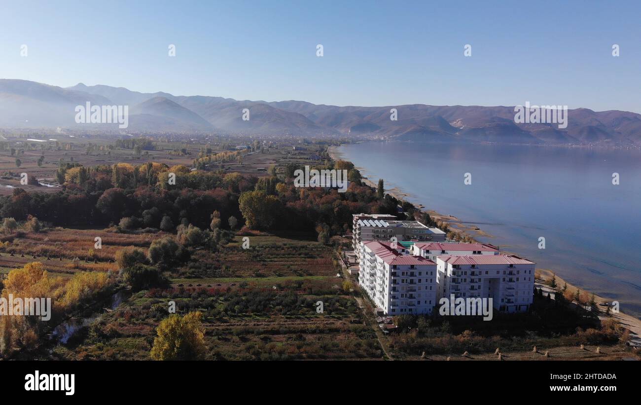 Drone Shot of the Beach in a Bright Day with Trees and Blue Water Stock ...