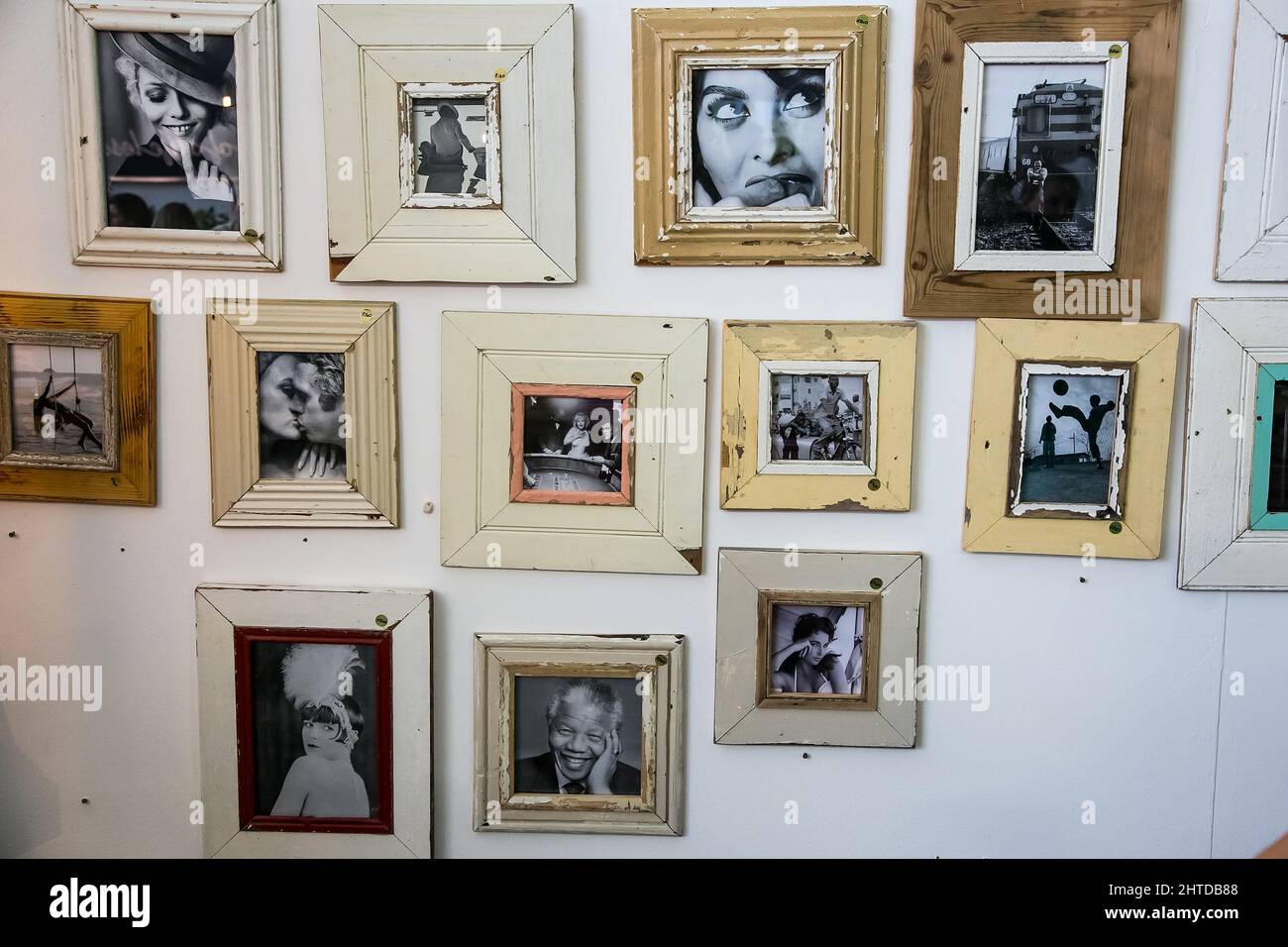 Set up of pictures inside frames on display at exhibitor stand at hand ...