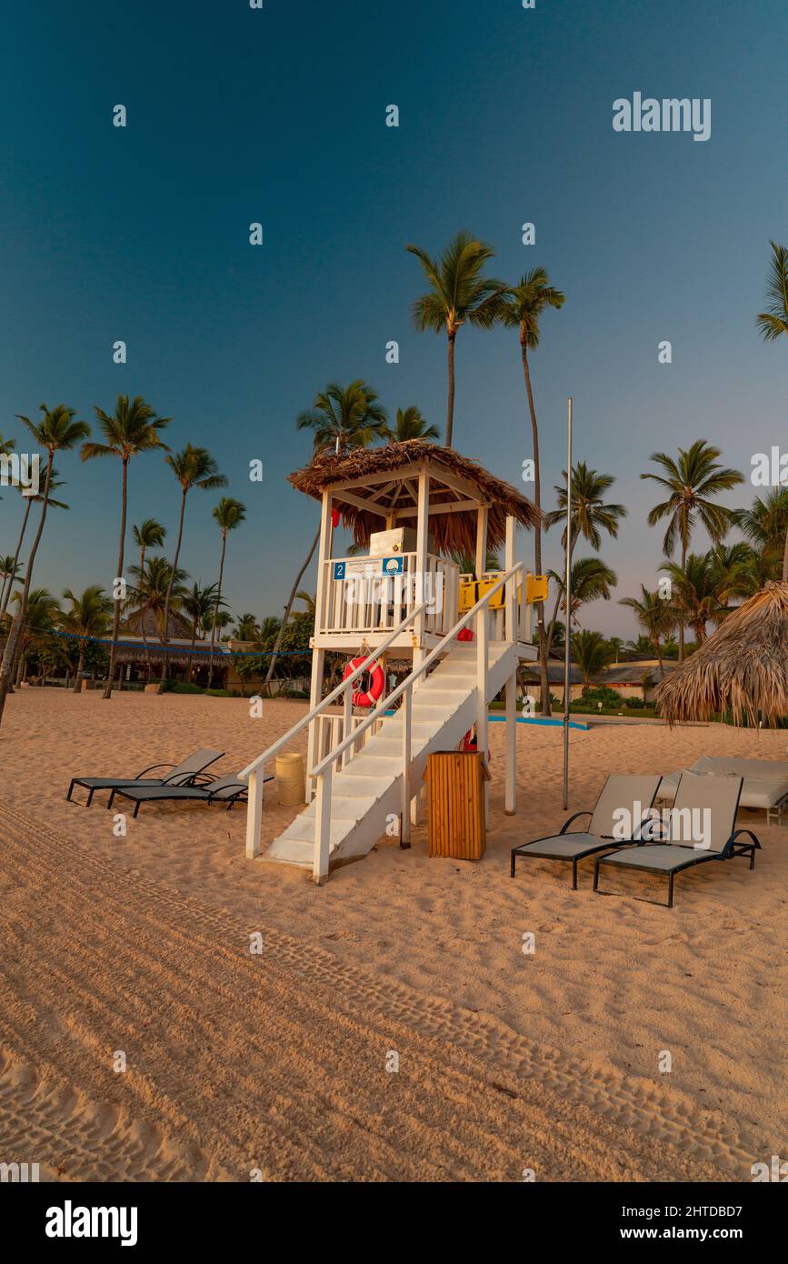 Vertical shot of a small wooden structure with stairs on a sandy beach ...
