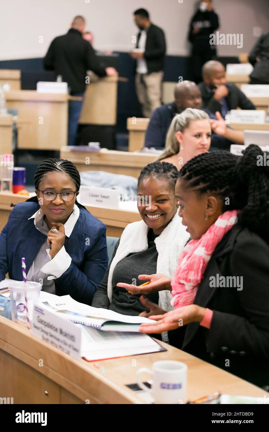 Spontaneous picture of three African woman discussing and smiling ...