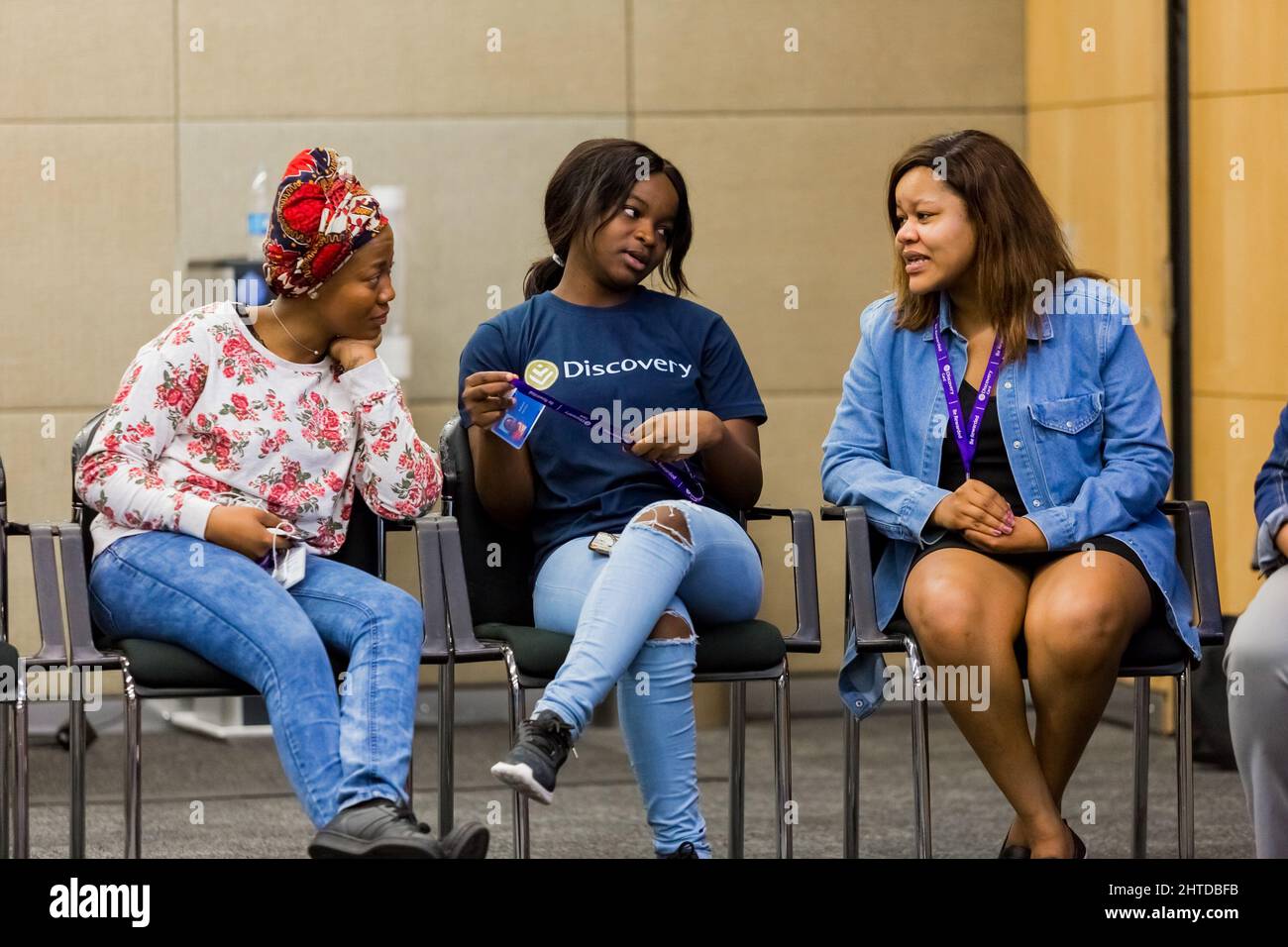 Closeup of the diverse adult students attending a class on finance ...