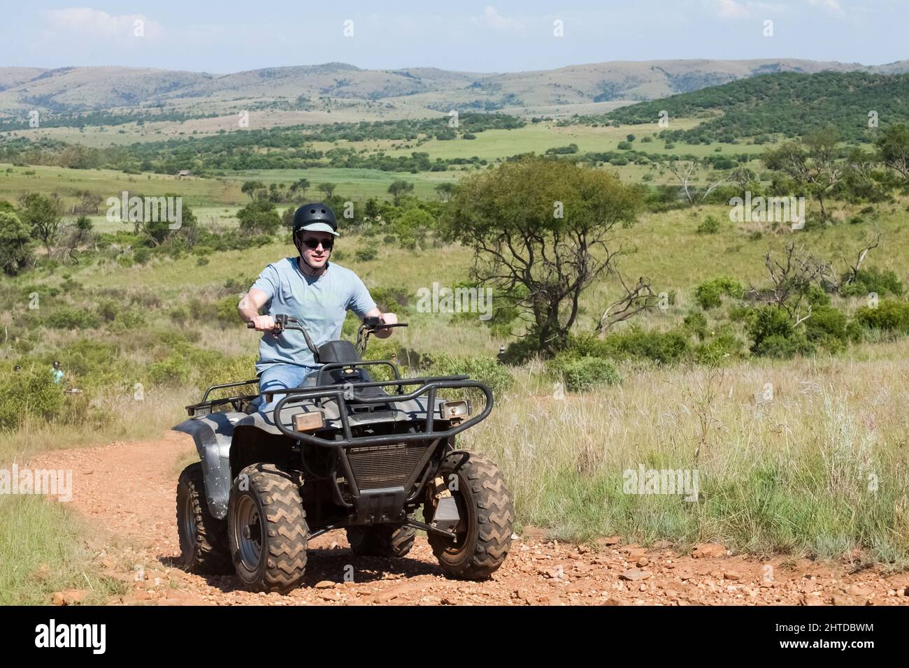 Man riding a quad bike on an adventure riding in Johannesburg on dirt ...
