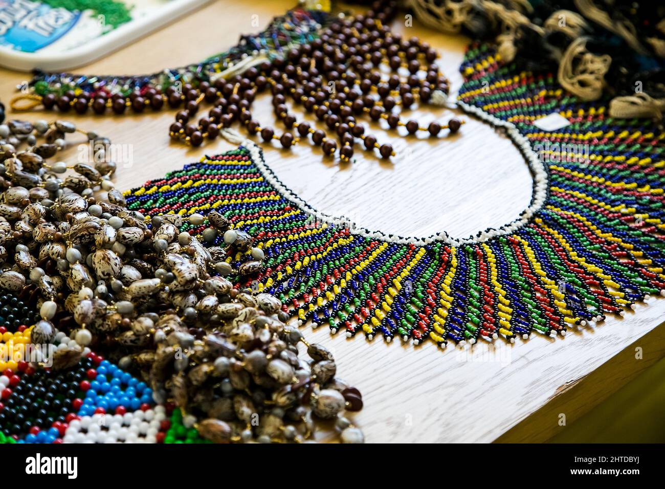 Set of colorful creative bead accessories on display at exhibitor stand ...