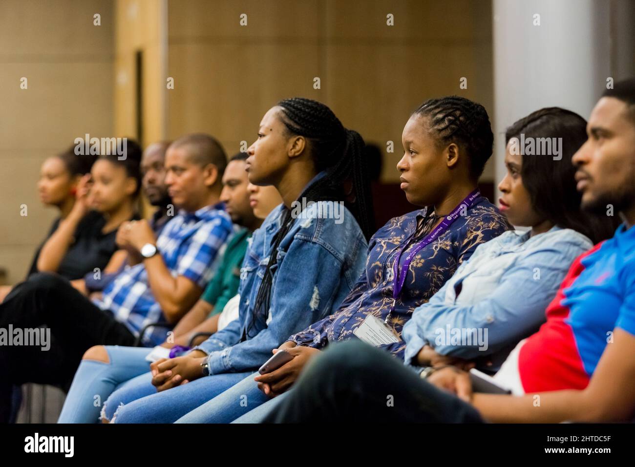 Closeup of the diverse adult students attending a class on finance ...