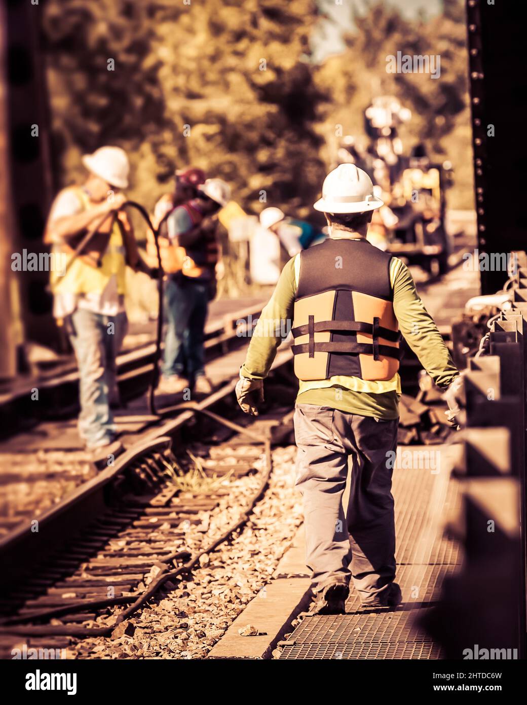 Railroad construction worker with hardhat and safety gear outdoors ...