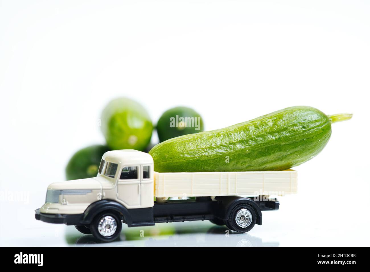 A light truck loaded with a cucumber Stock Photo - Alamy