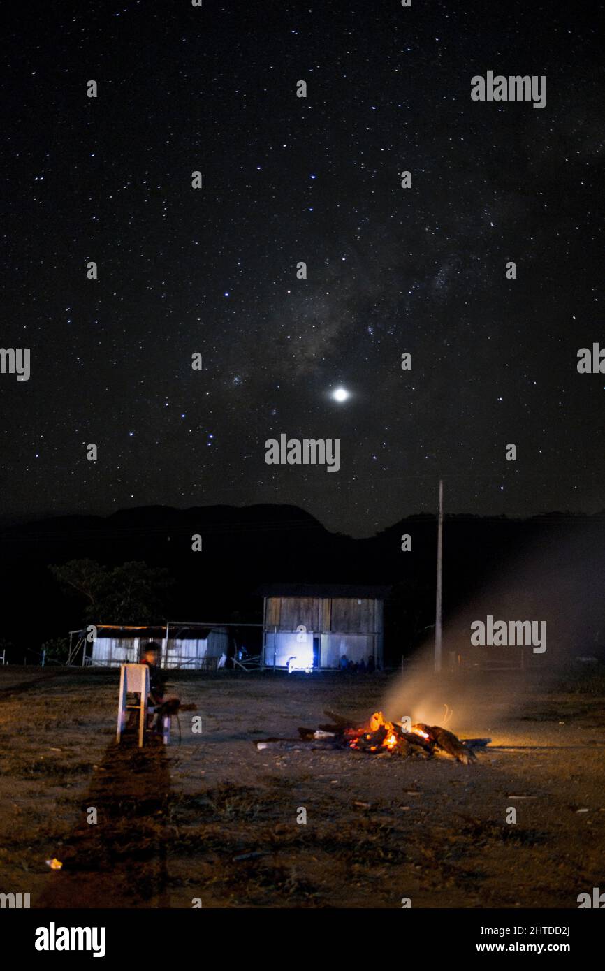 Night landscape with a dark forest bright moon big bonfire and starry ...
