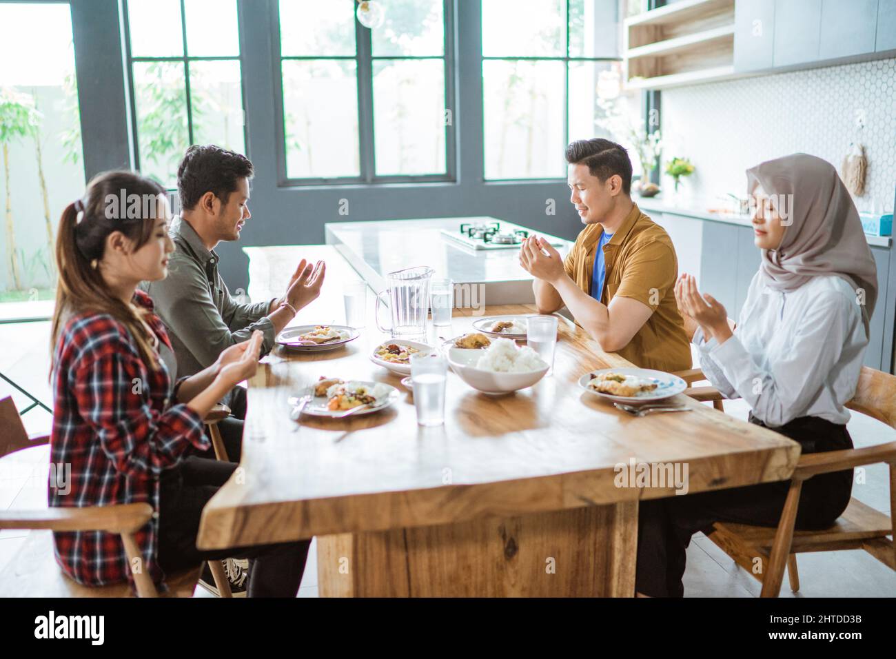 asian young people eating lunch together in the kitchen Stock Photo - Alamy