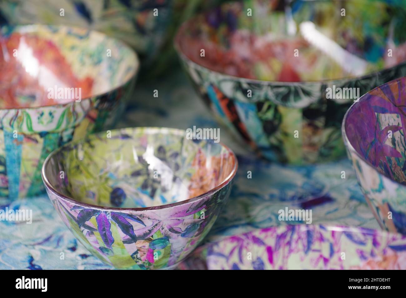 Closeup of colorful glass bowls with floral patterns Stock Photo - Alamy