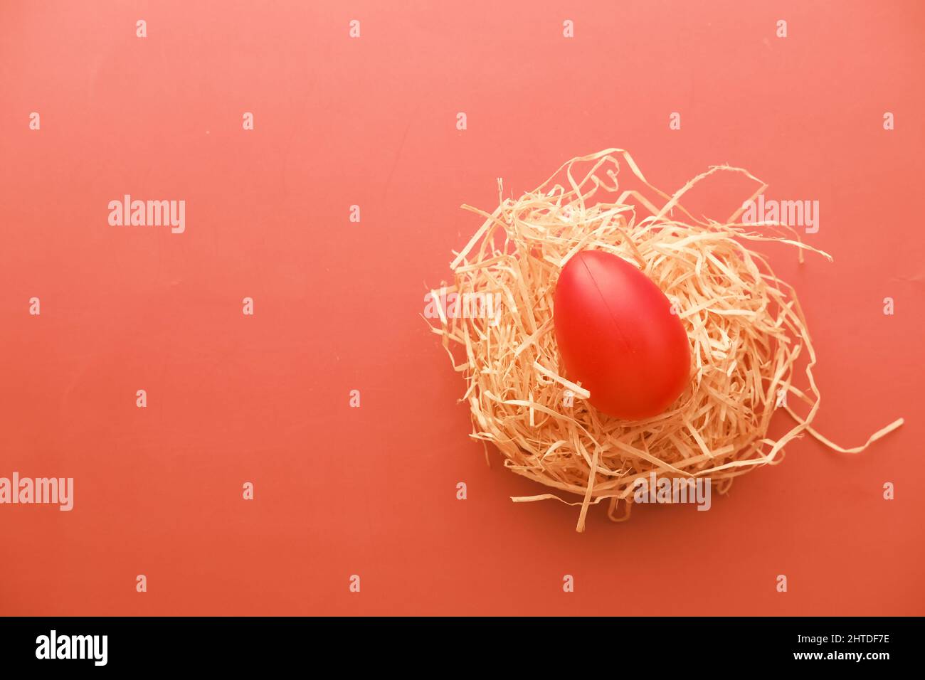 easter concept with red color egg on a red background Stock Photo - Alamy