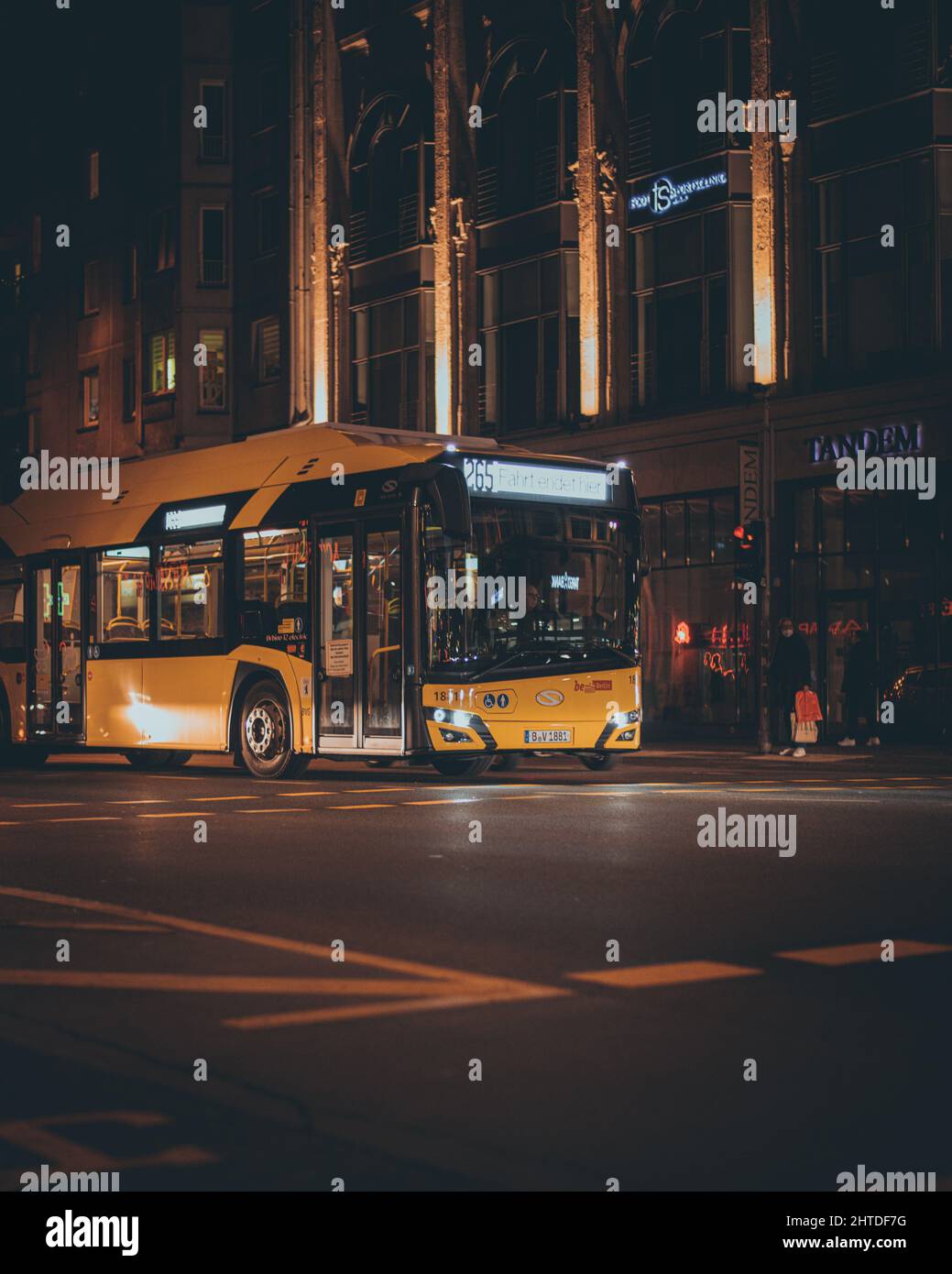 Modern bus on a street in Berlin, Germany at night Stock Photo - Alamy