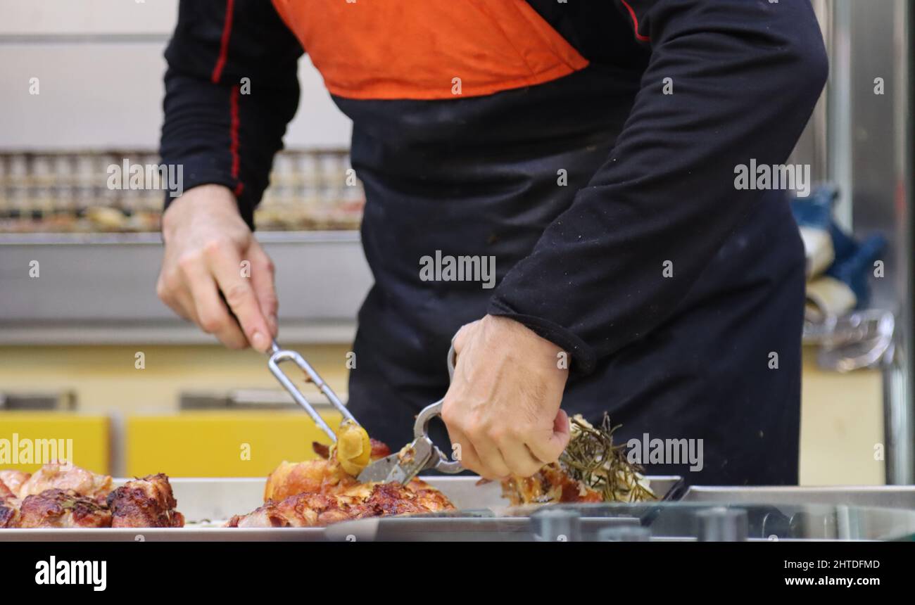 Professional chef cutting fresh meat hi-res stock photography and ...