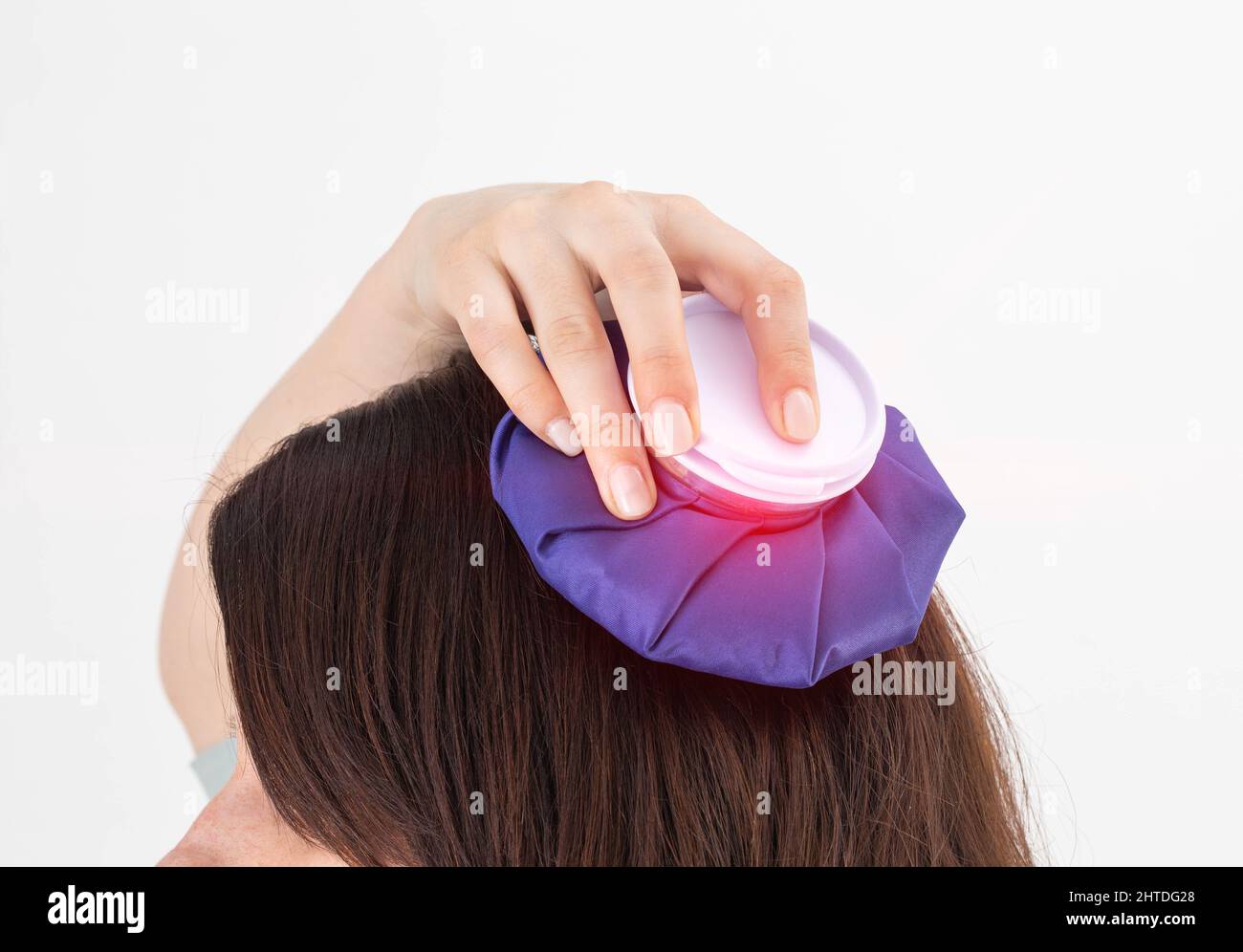 The girl applies a medical ice pack to her head. The concept of ...