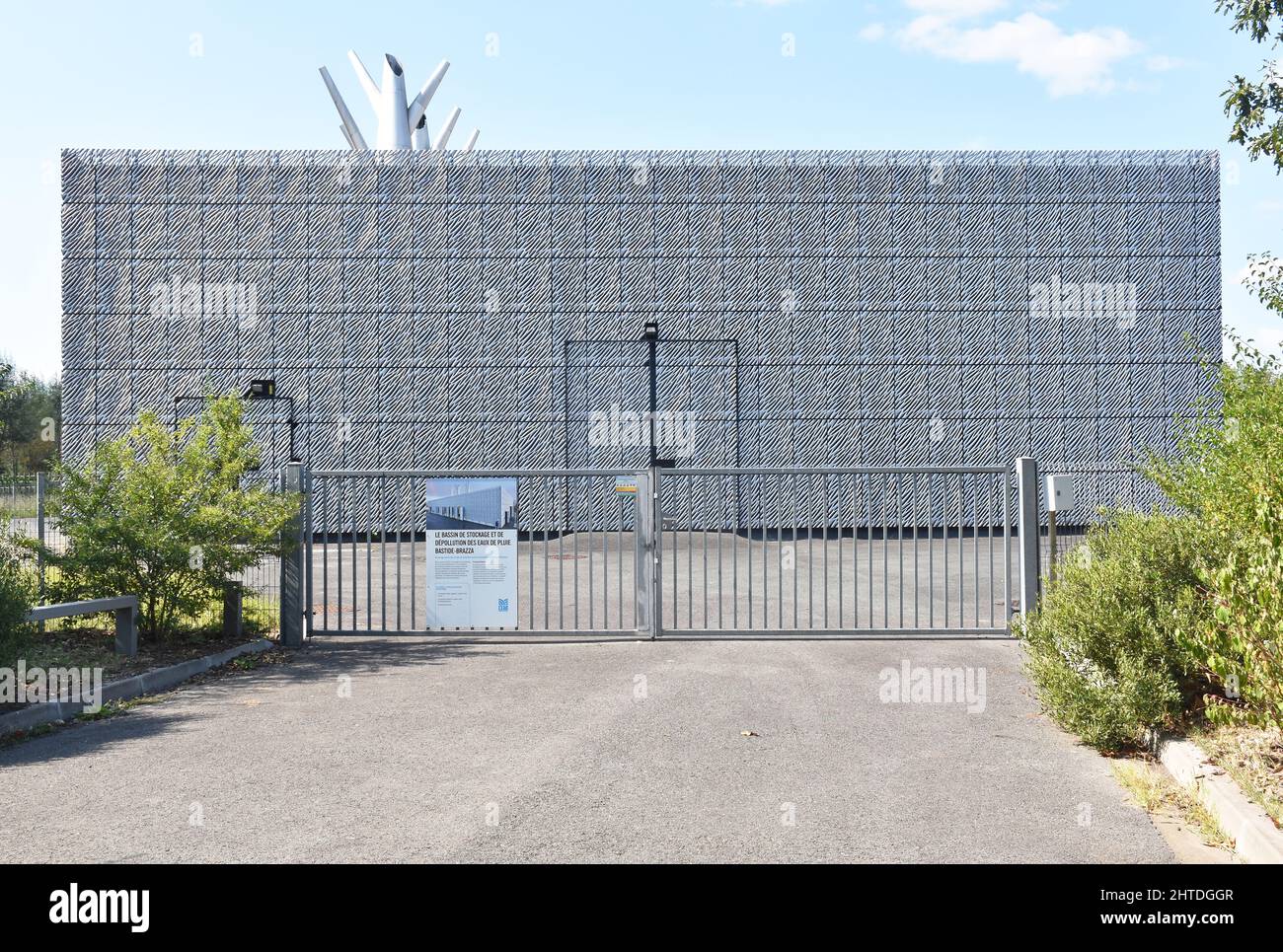 A mysterious windowless box, with weird chimneys, clad in rectangular ...