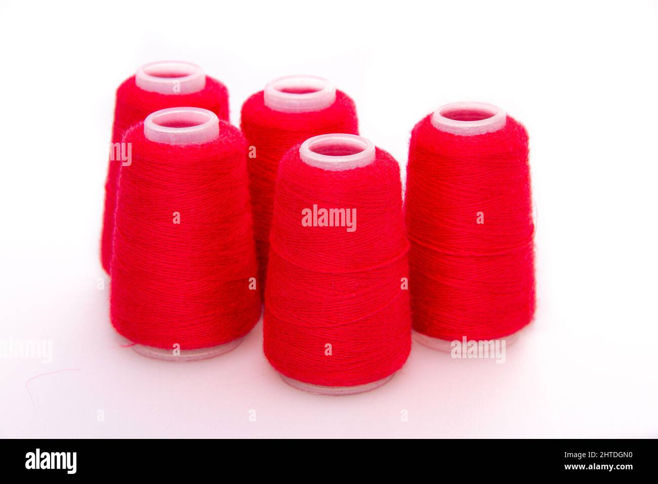 Red spool of thread isolated on white background. Skein of woolen ...