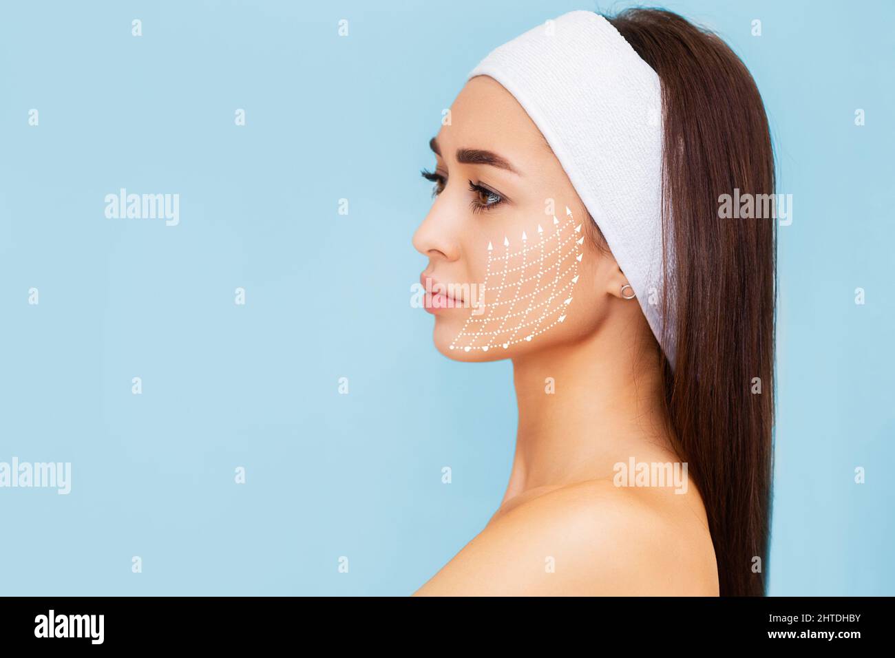 Portrait of a young Caucasian woman with a painted grid on her face ...