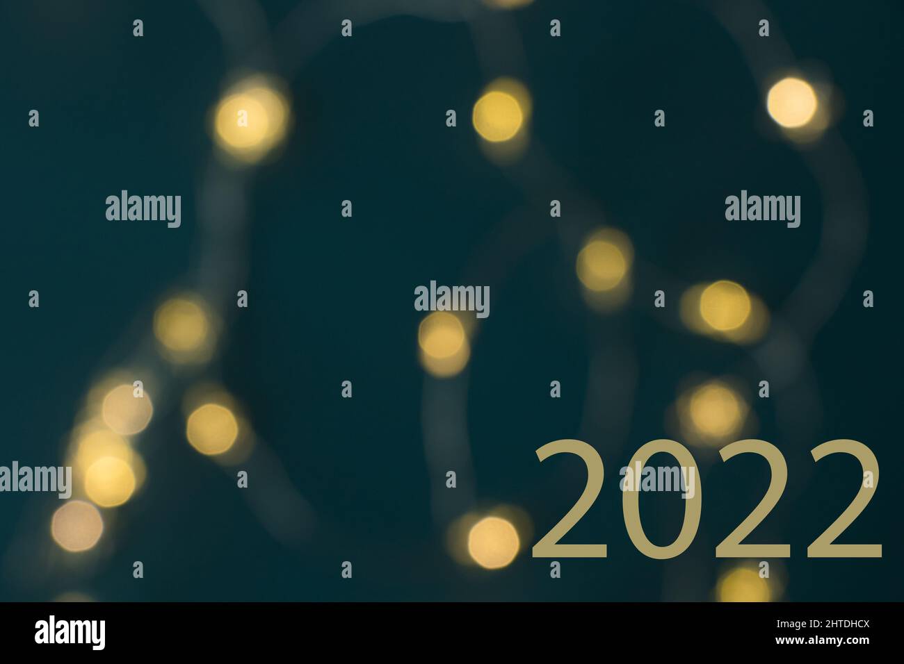 Illustration of new 2022 year text over a dark blue background with led ...