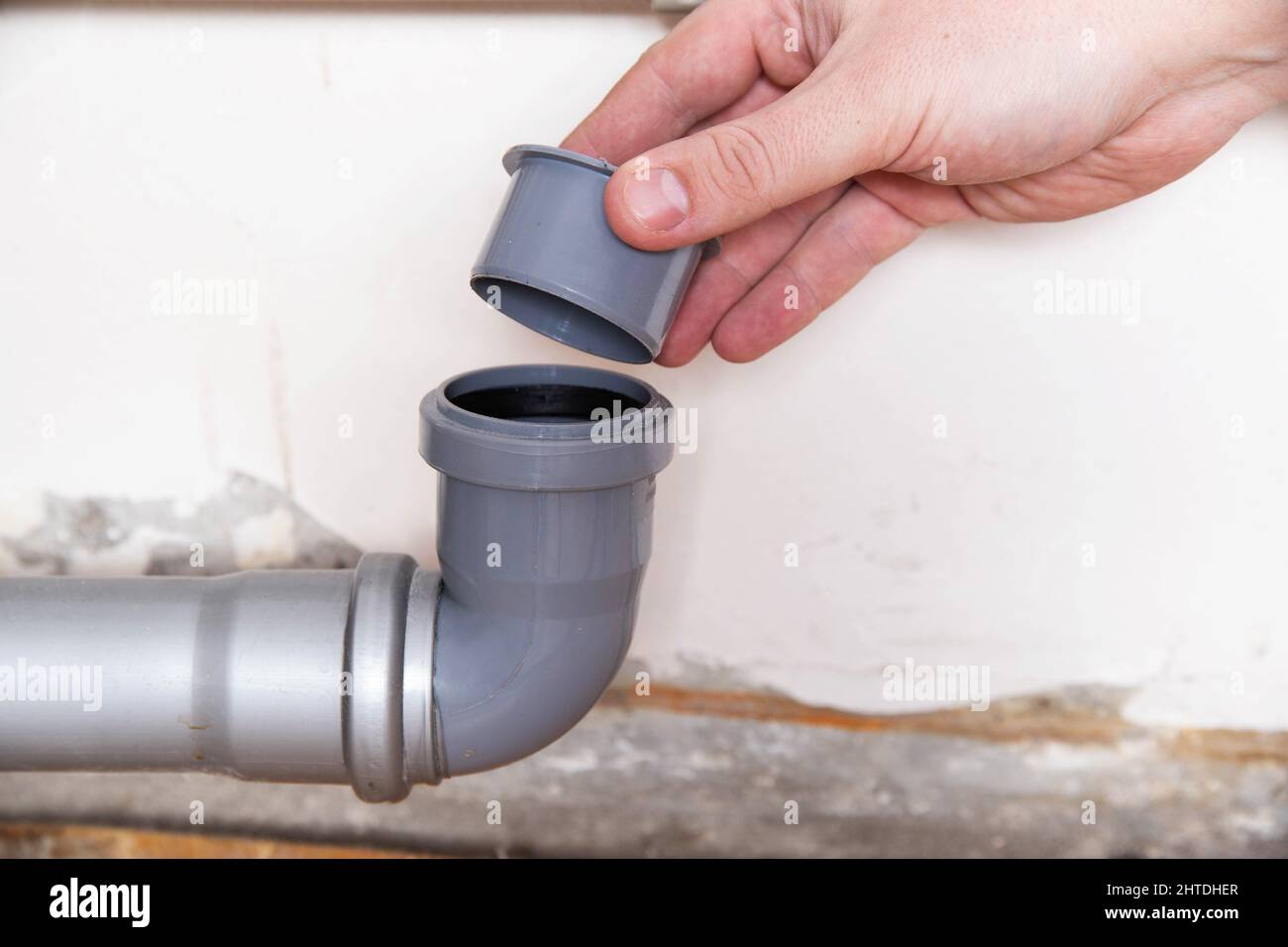 Installing a plug in the drain hole of the sewer from an unpleasant ...