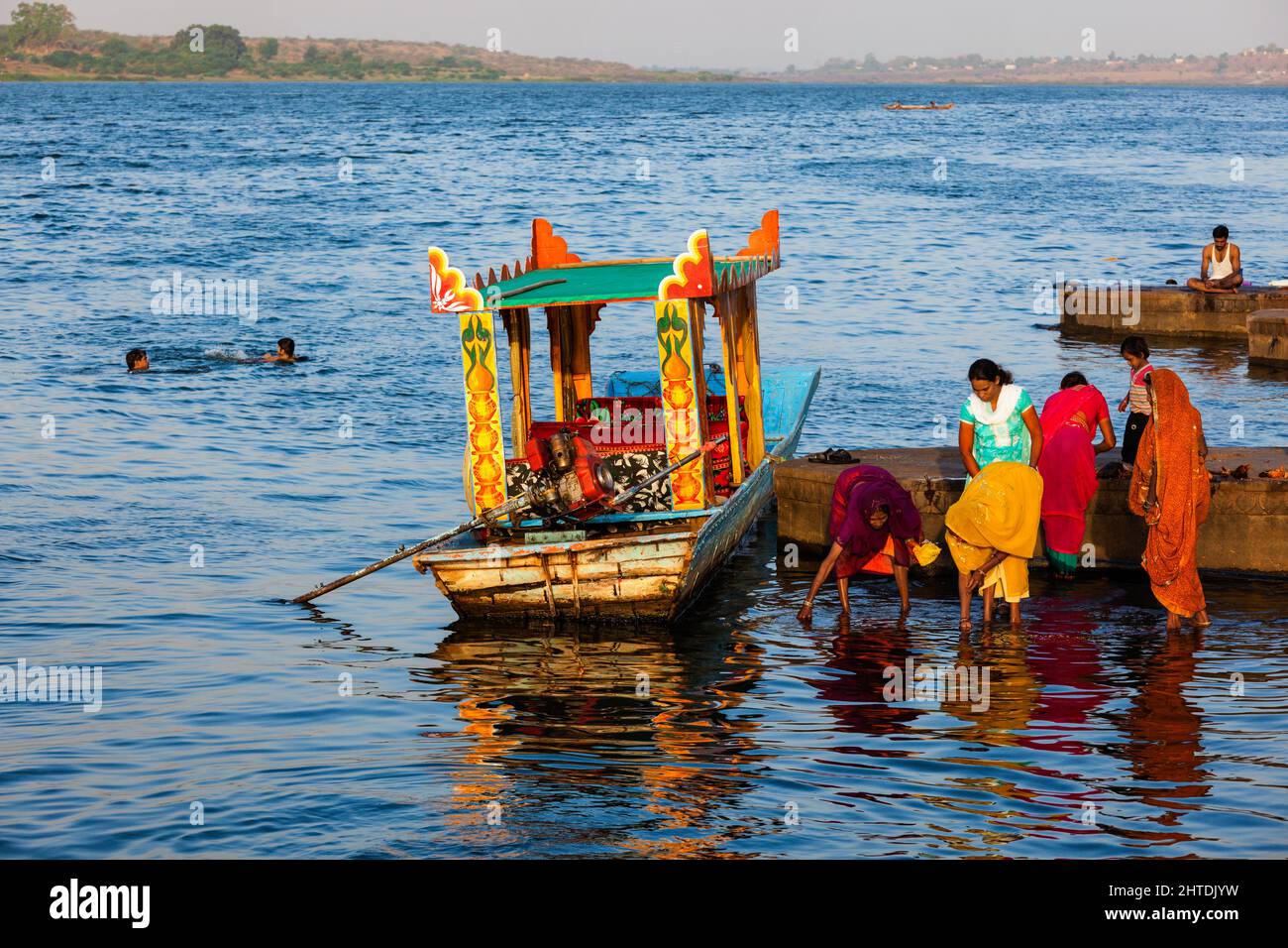 Women doing morning pooja Stock Photo - Alamy