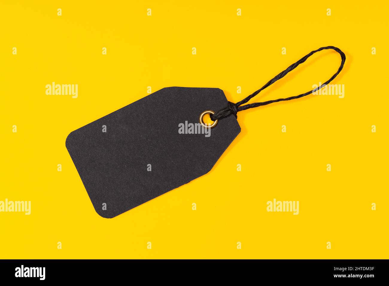 Black price Tag isolated on yellow background. Template mock up Stock ...