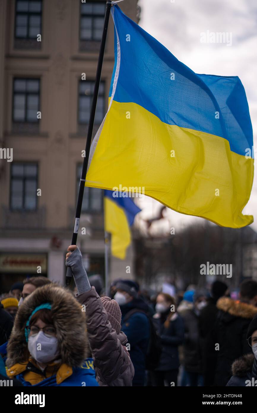 Ukrainian flags at anti-war protest in Munich after Russia invaded ...