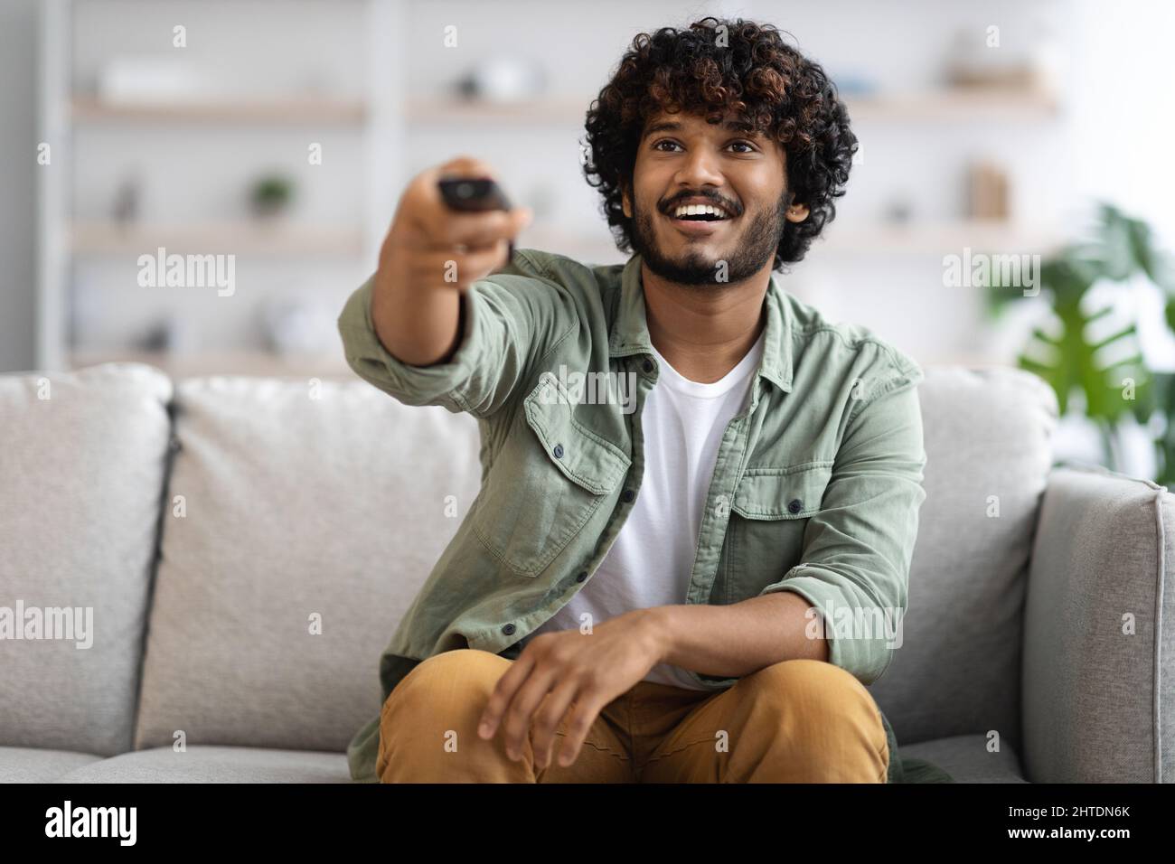 Positive indian guy remote hi-res stock photography and images - Alamy