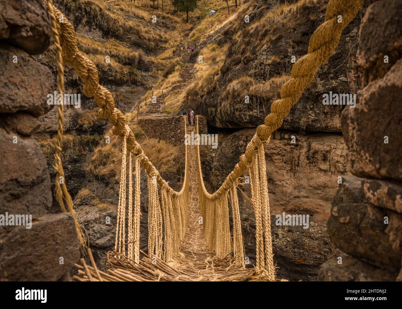 Scenic shot of a bridge in Apurimac river valley in Peru surrounded by ...