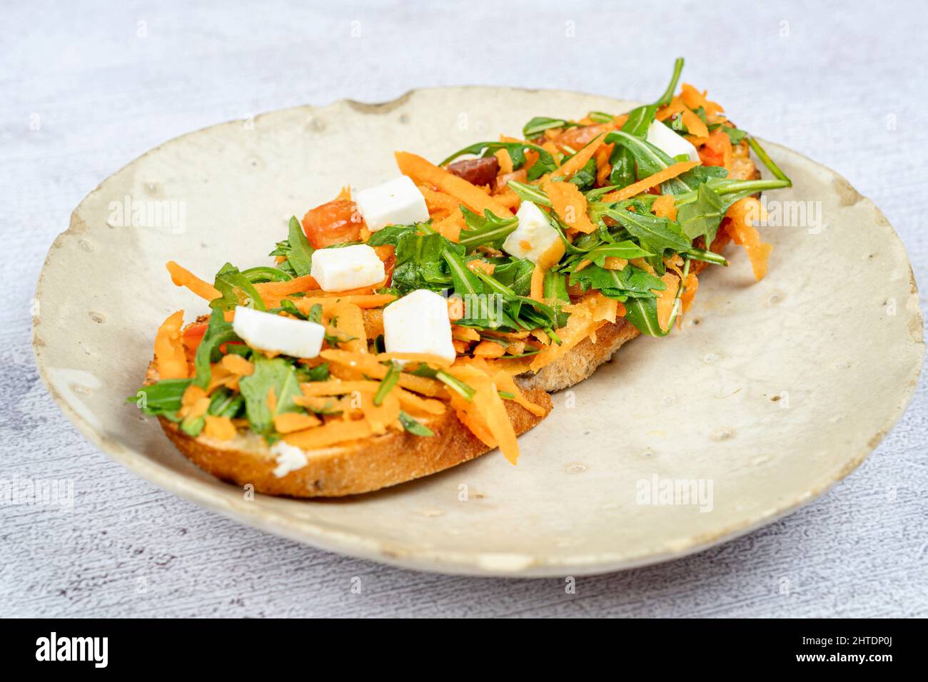 Delicious sandwich with natural organic bread, cheese, carrots, olives ...