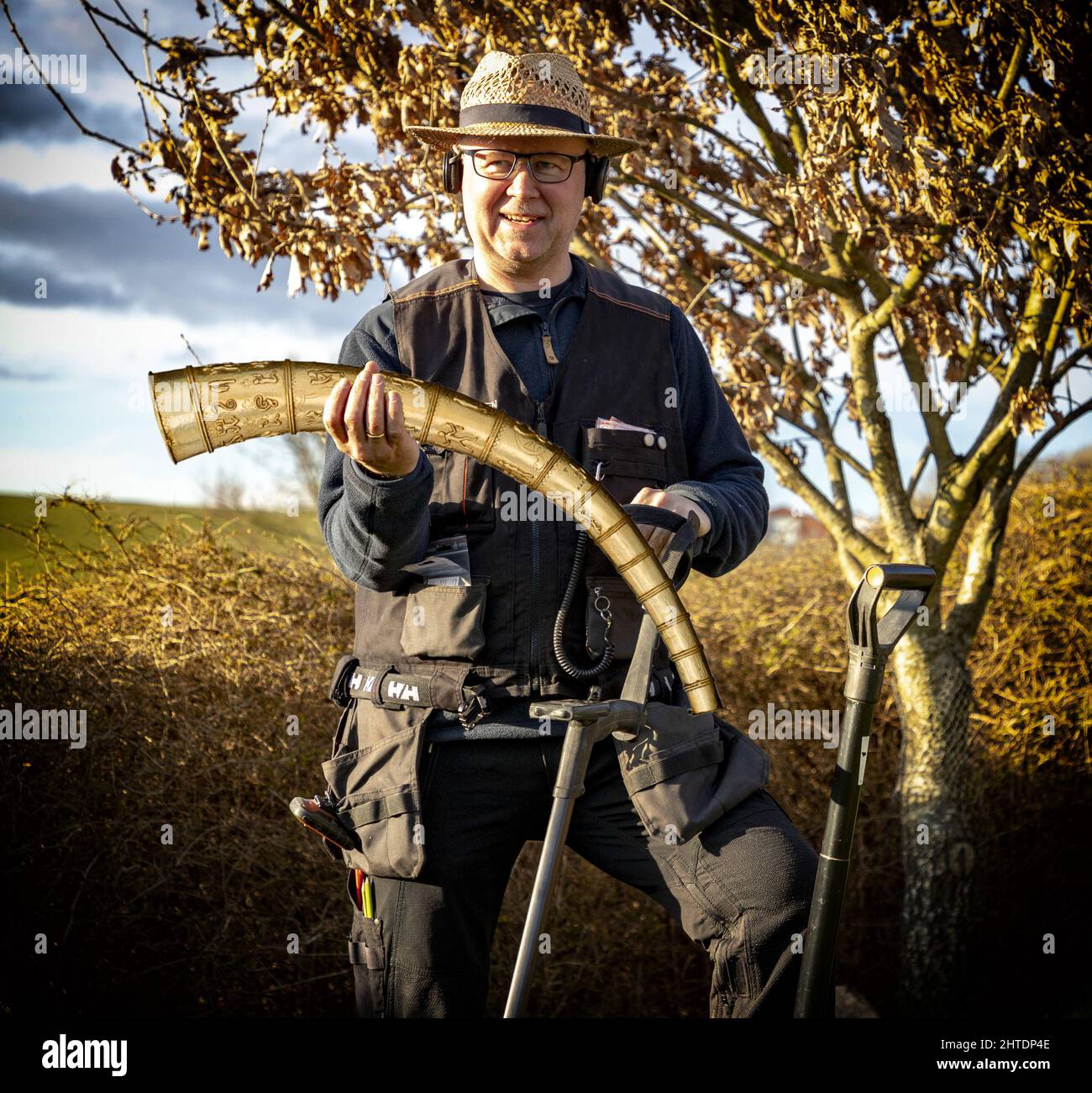 Caucasian metal detectorist with a replica of gold horn Stock Photo - Alamy