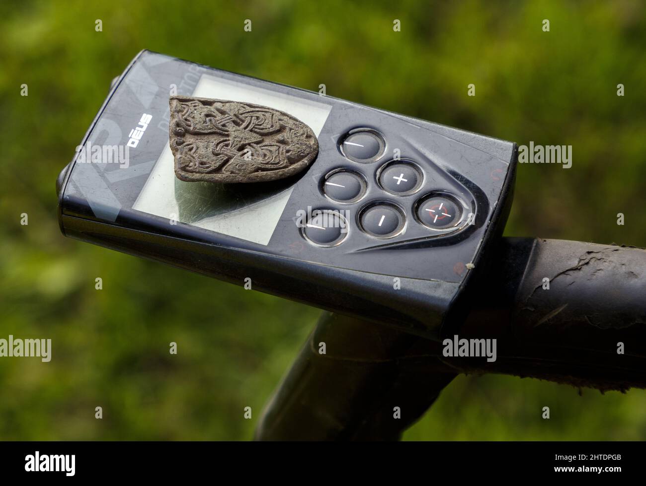 Viking Age fibula, fragmented, bronze on a metal detecting tool in ...
