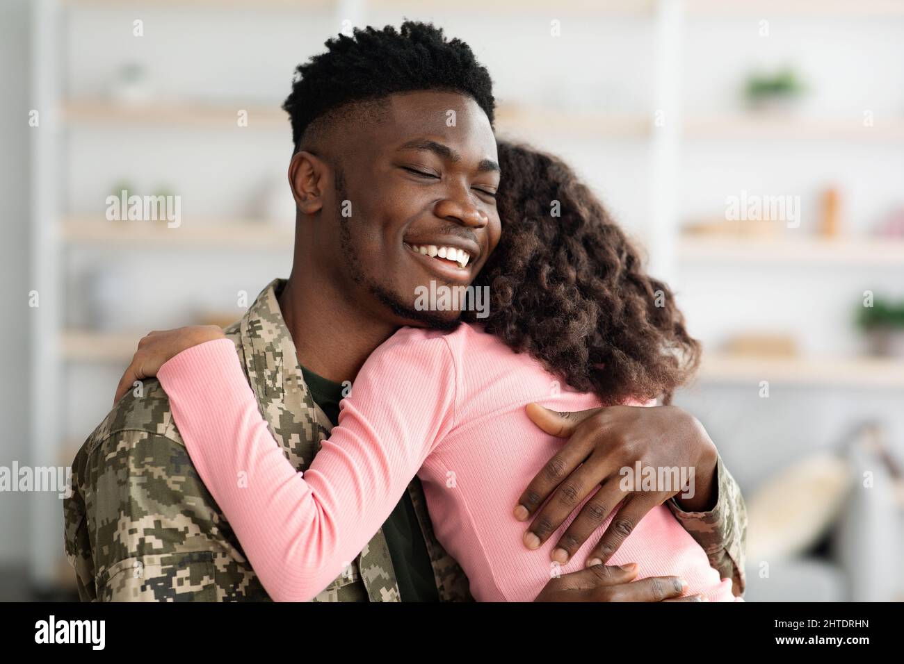 Army uniform man hugging hi-res stock photography and images - Alamy