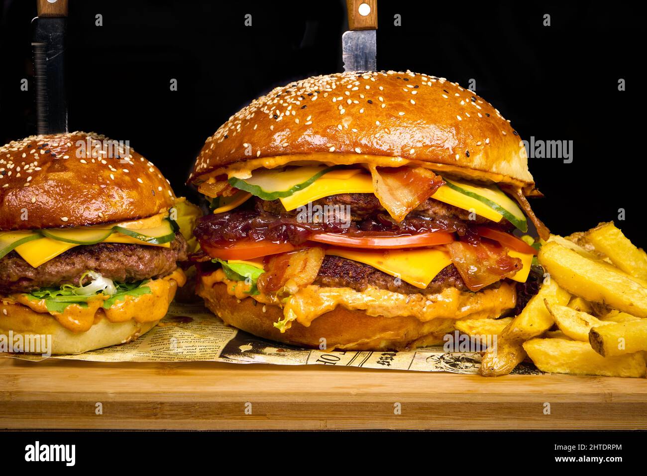 Closeup of a hamburger fast food with fries Stock Photo - Alamy