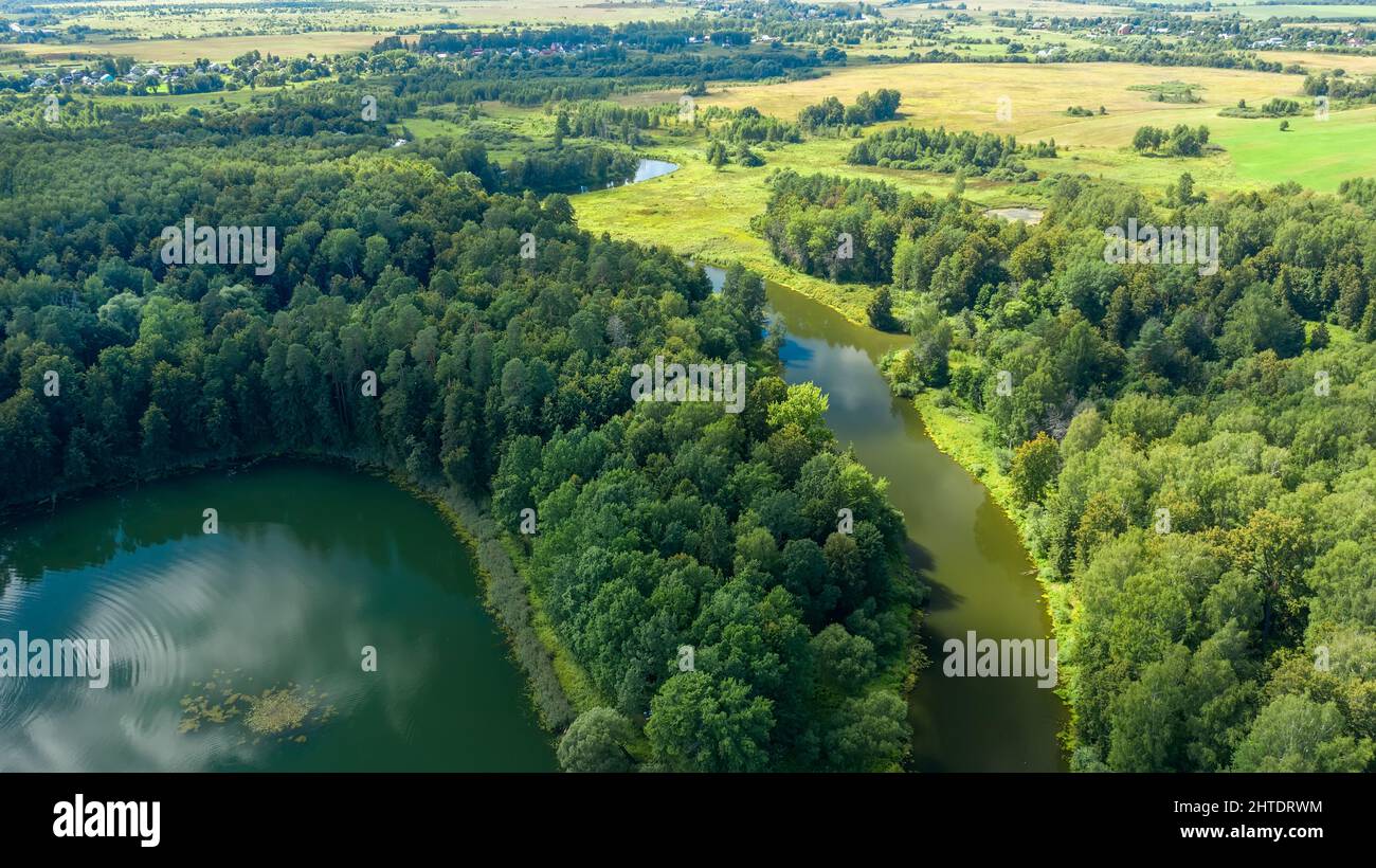 Aerial view of the countryside and a circular lake in the middle of the ...