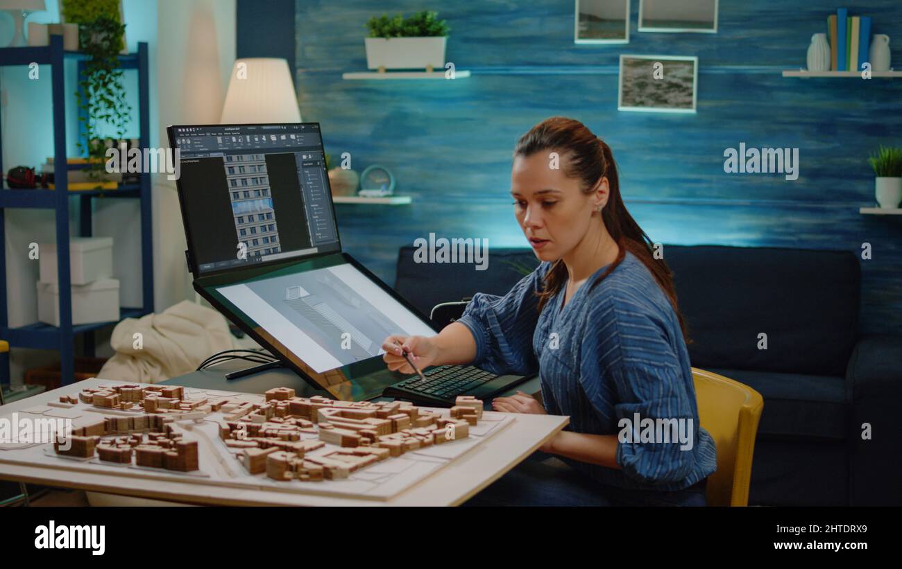 Woman Architect Using Building Model On Monitor With Touch Screen Young Engineer Working On
