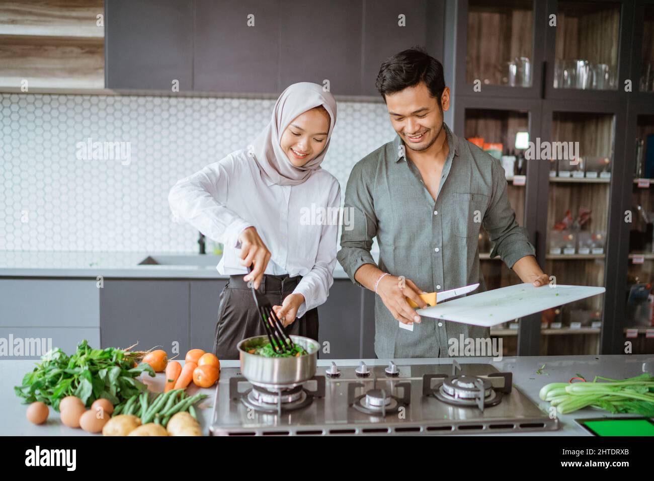 romantic young muslim couple have fun making food at home Stock Photo ...