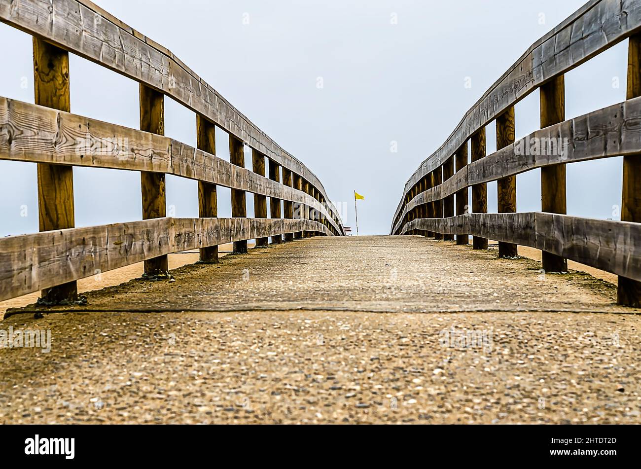 Perspective view from a wooden bridge at the entrance to a beach Stock ...