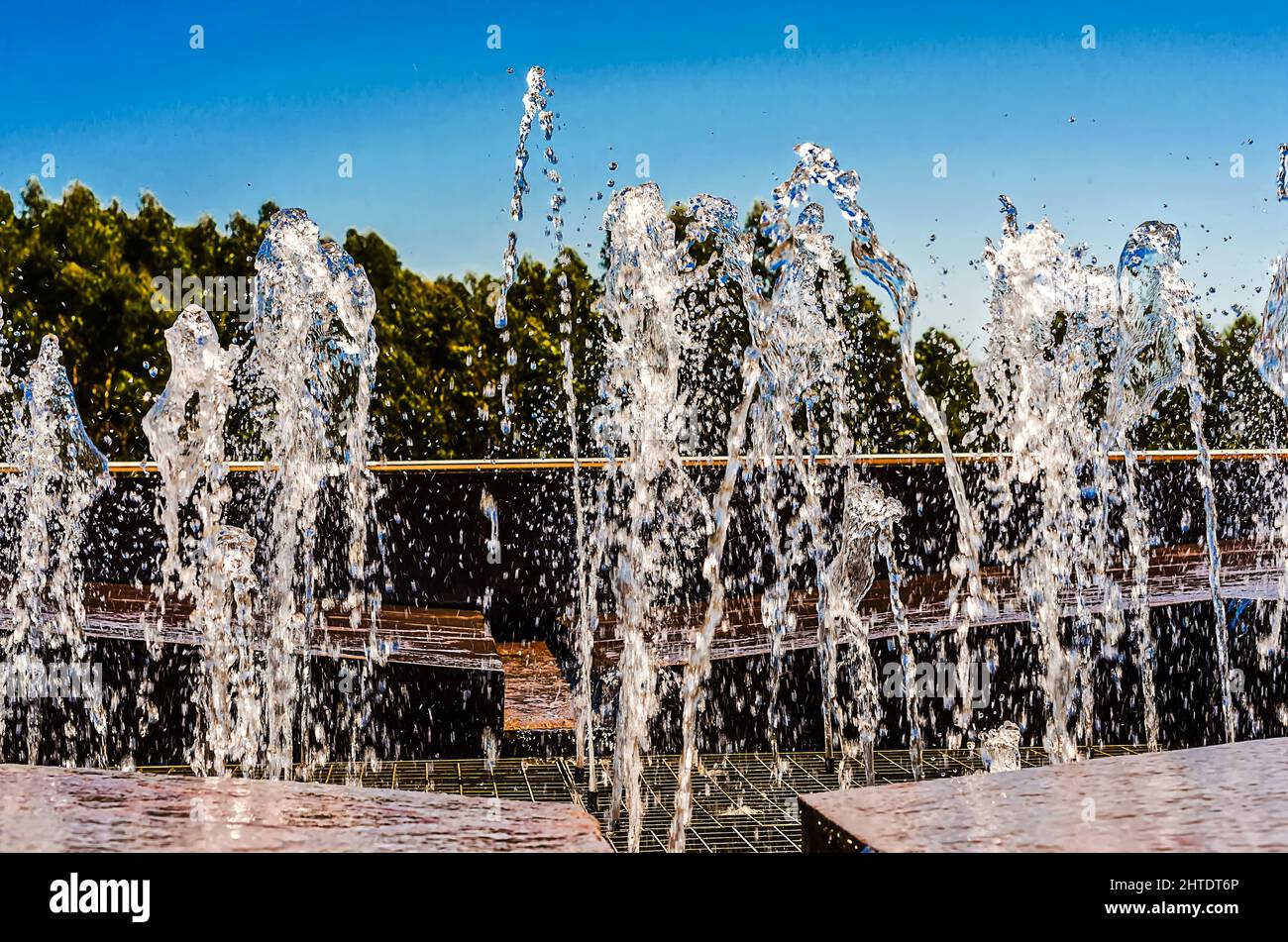Photo of water jets pouring from a fountain into the terrace of a ...