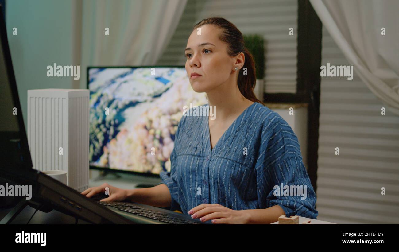 Woman architect using touch screen for building model and maquette layout. Engineer working with ...