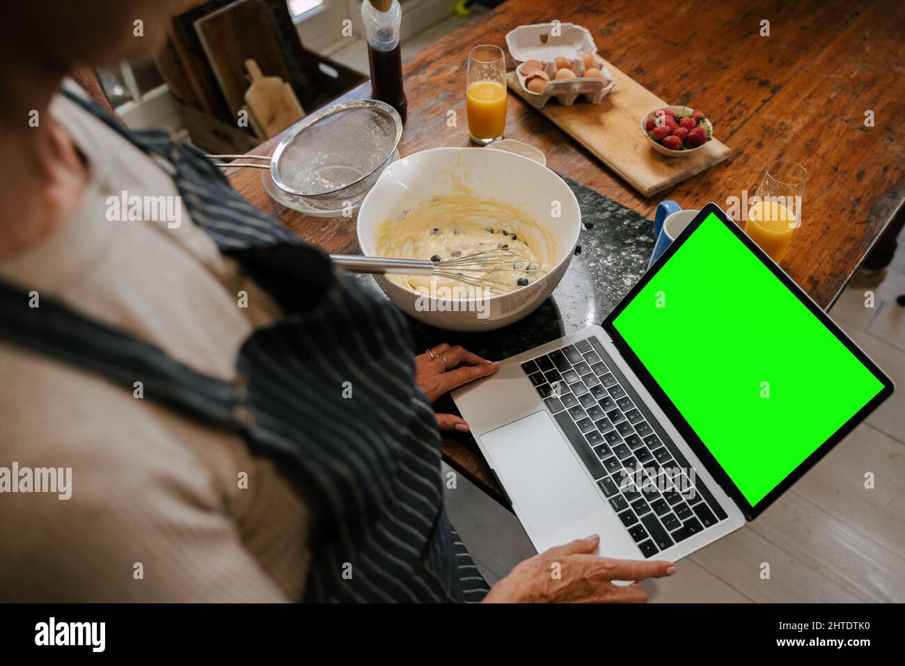 baking in the kitchen with top view of laptop screen for recipes Stock ...